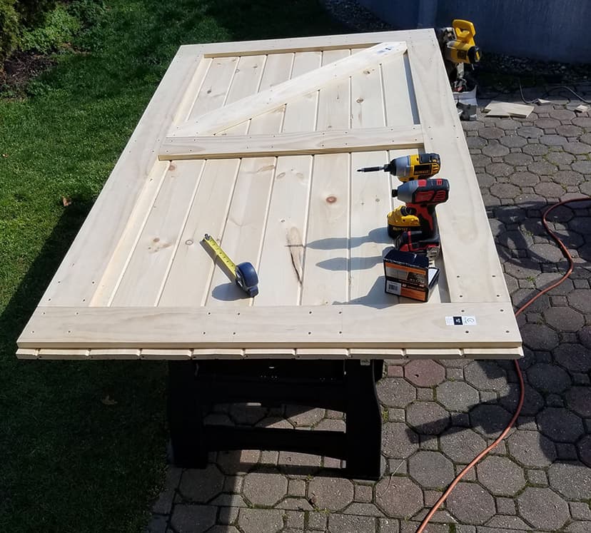 How To Build A Sliding Barn Door For Less - The Honeycomb Home