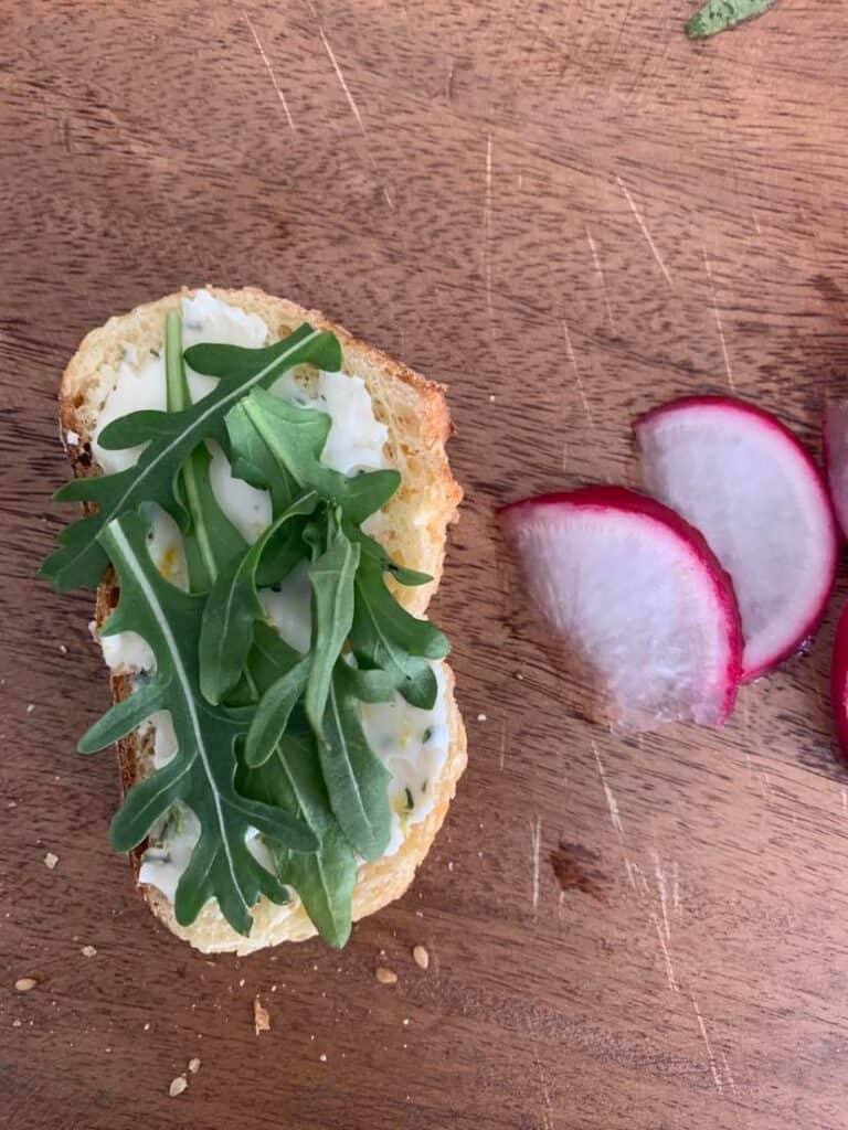 Crostini With Herb Butter And Arugula - The Honeycomb Home
