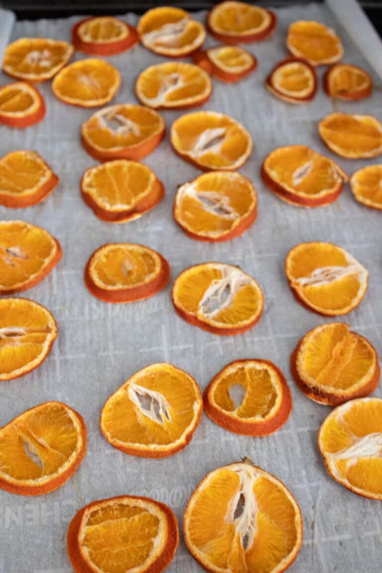 DIY Fall Centerpiece With Flowers and Dried Fruit - The Honeycomb Home